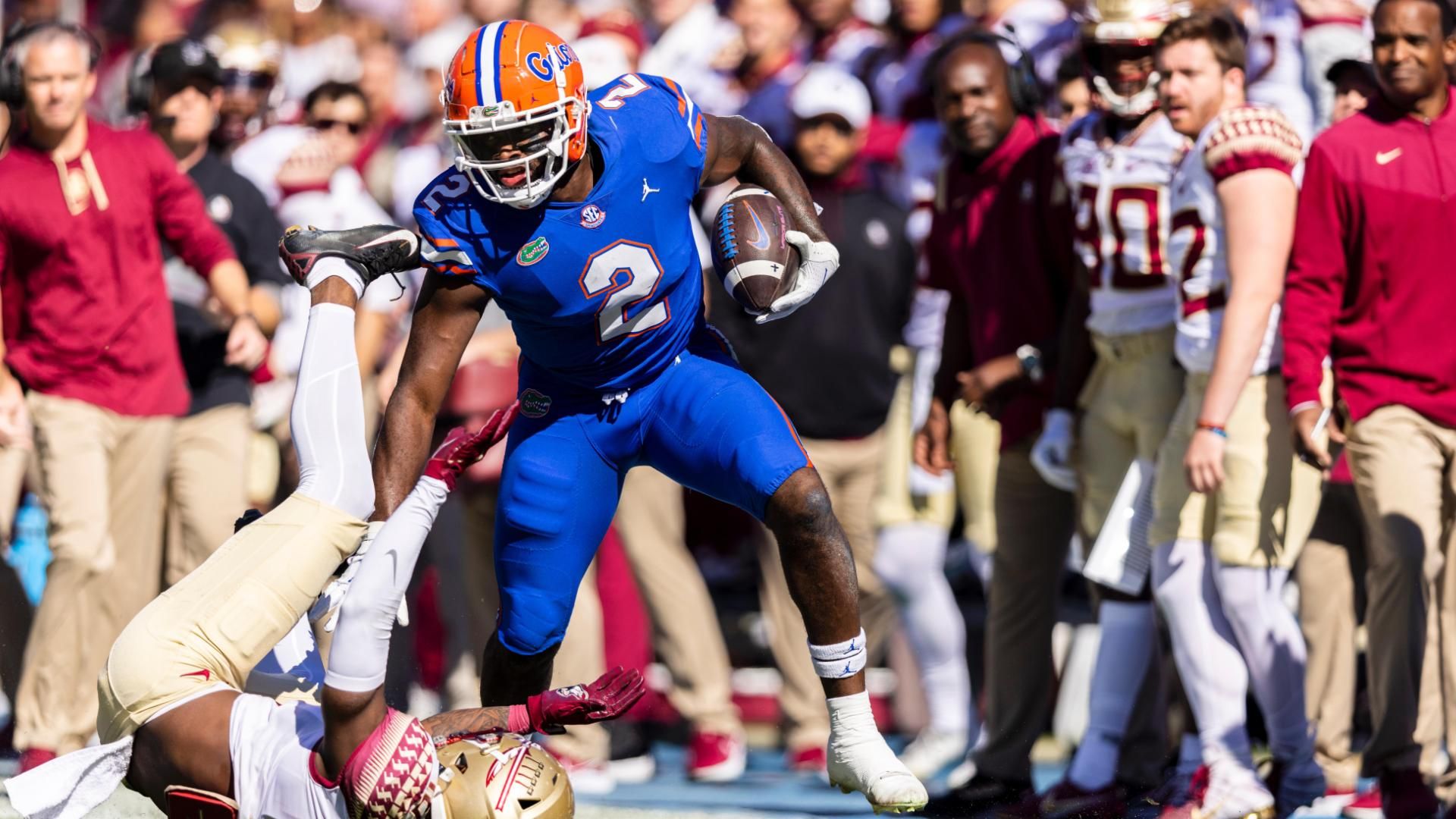 Kemore Gamble fights to keep his footing before reaching the end zone ...