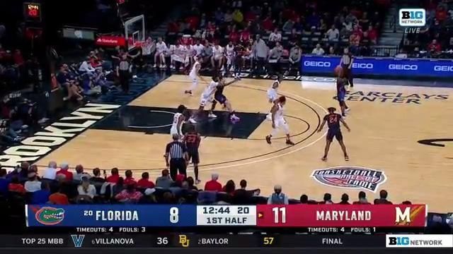 Colin Castleton gets around the defender to finish strong at the hole ...