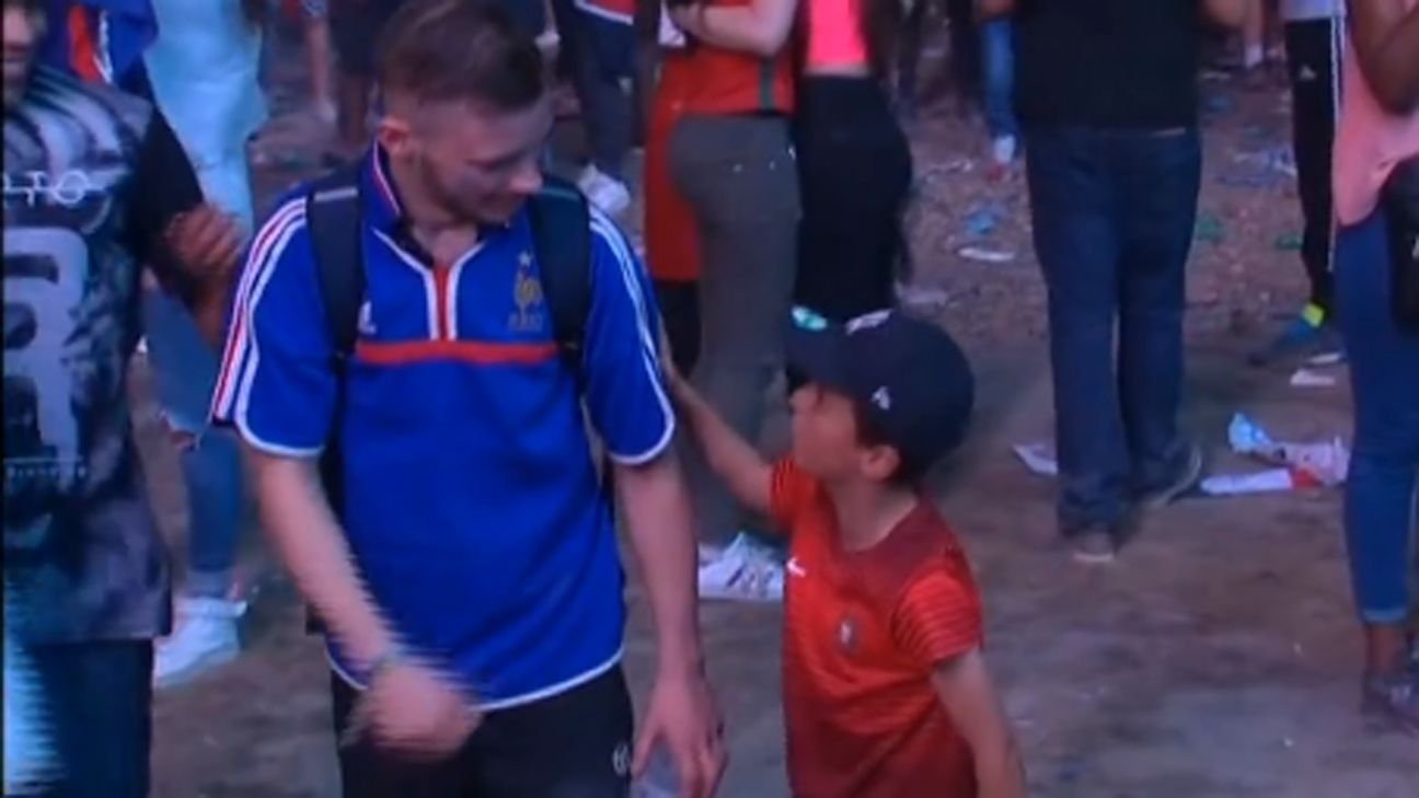 Portuguese boy consoles crying France fan after Euro 2016 final - ESPN