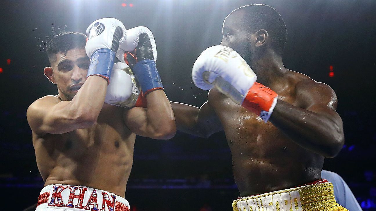 Crawford wins by TKO when Khan can't continue - ESPN
