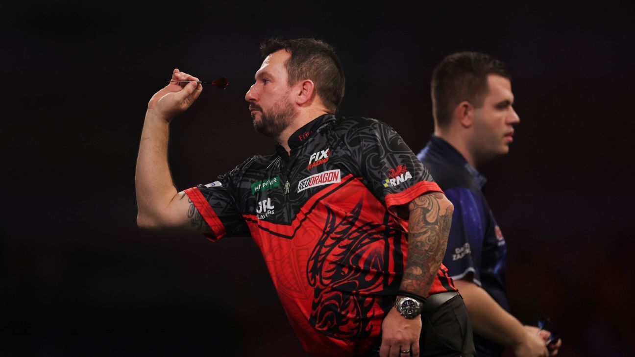 World Darts Championship: Jonny Clayton holds his nerve to reach last ...